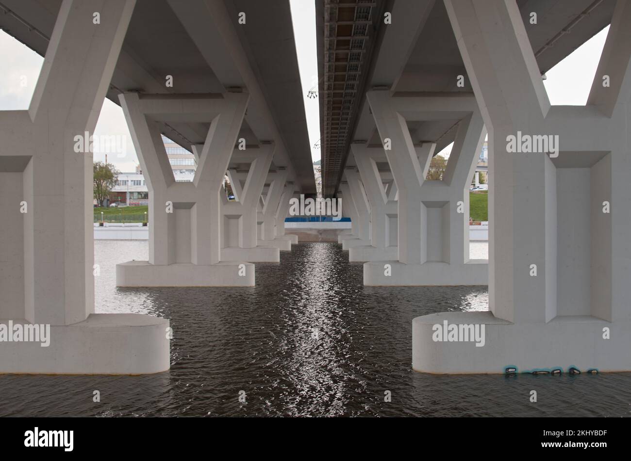 Bottom view of the concrete bridge over the river Stock Photo - Alamy