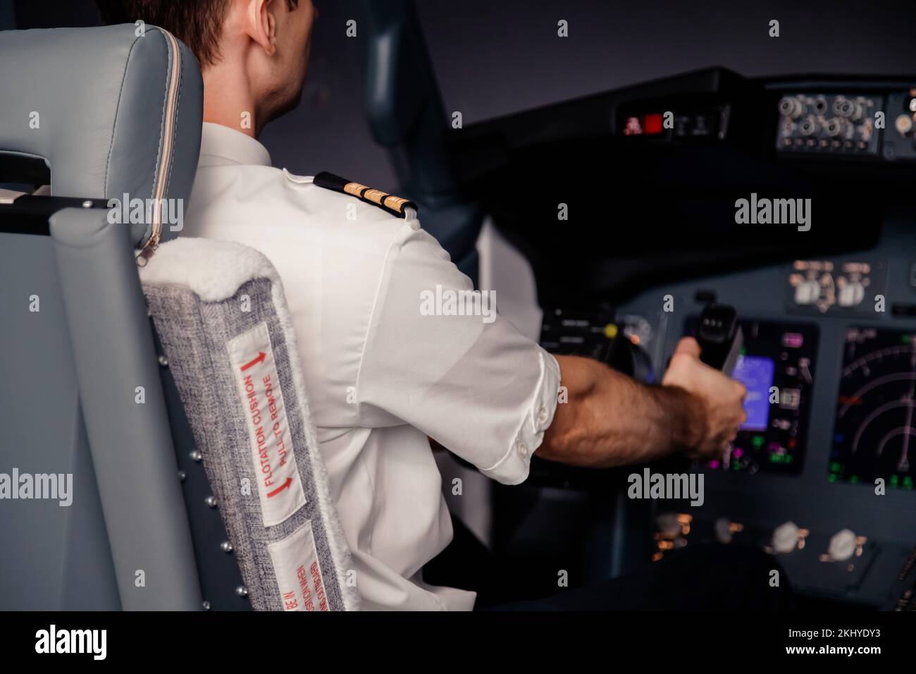 Back view over woman pilot flying an aircraft, wearing headset Stock ...