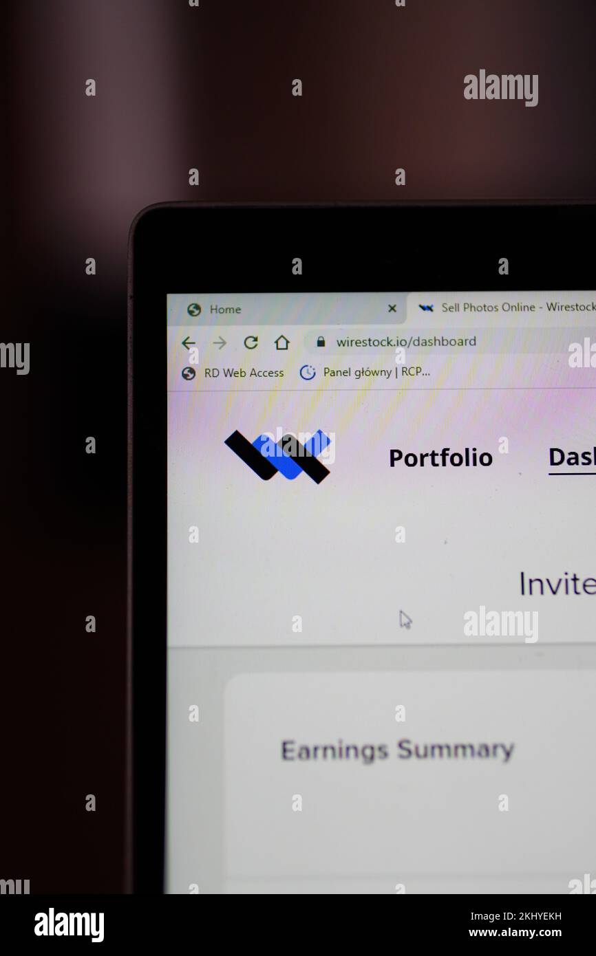 The wirestock logo on an opened laptop LCD screen Stock Photo - Alamy