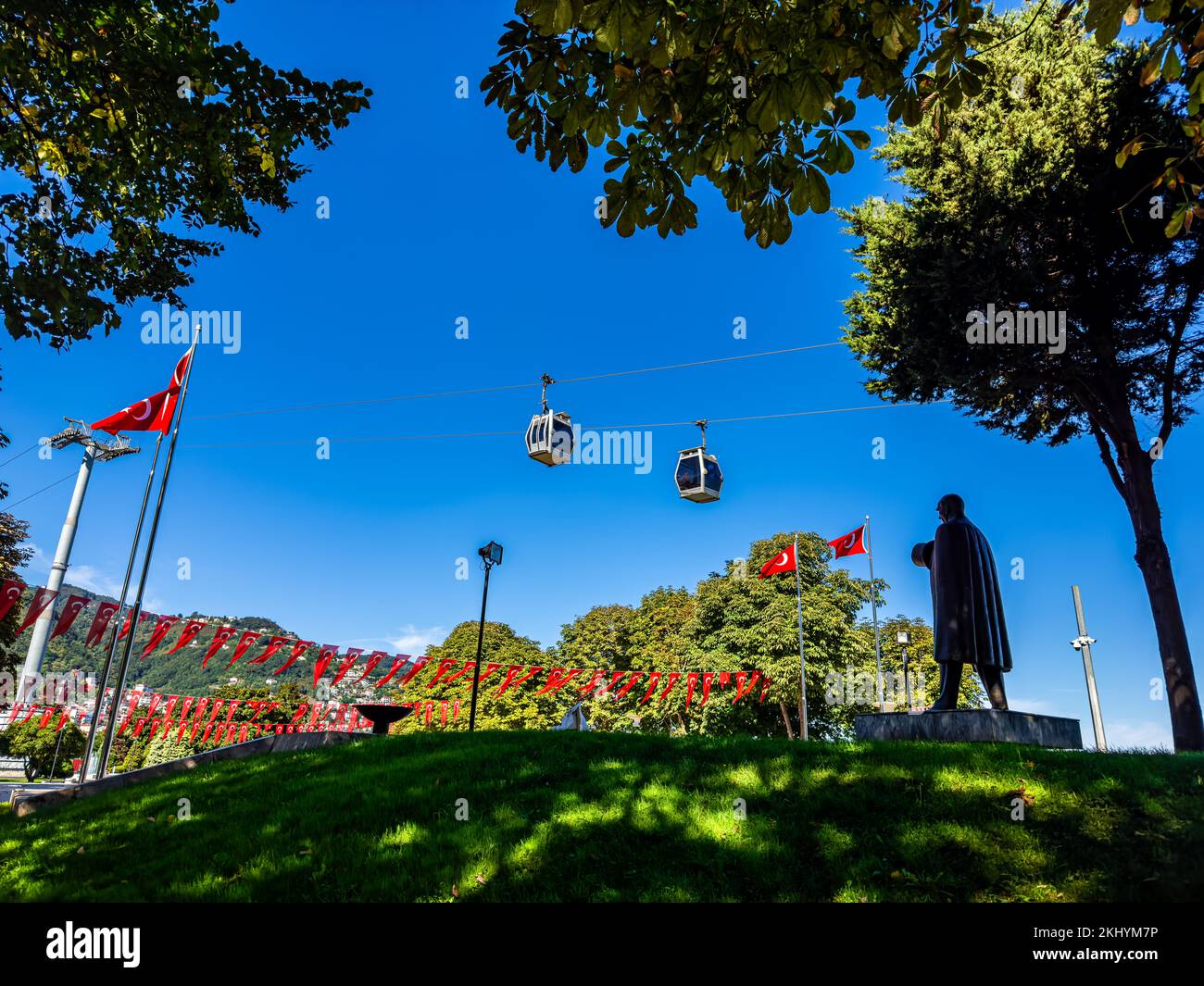 Two opposite cable cars, Ataturk statue and Turkish flags. Ordu, Turkey ...