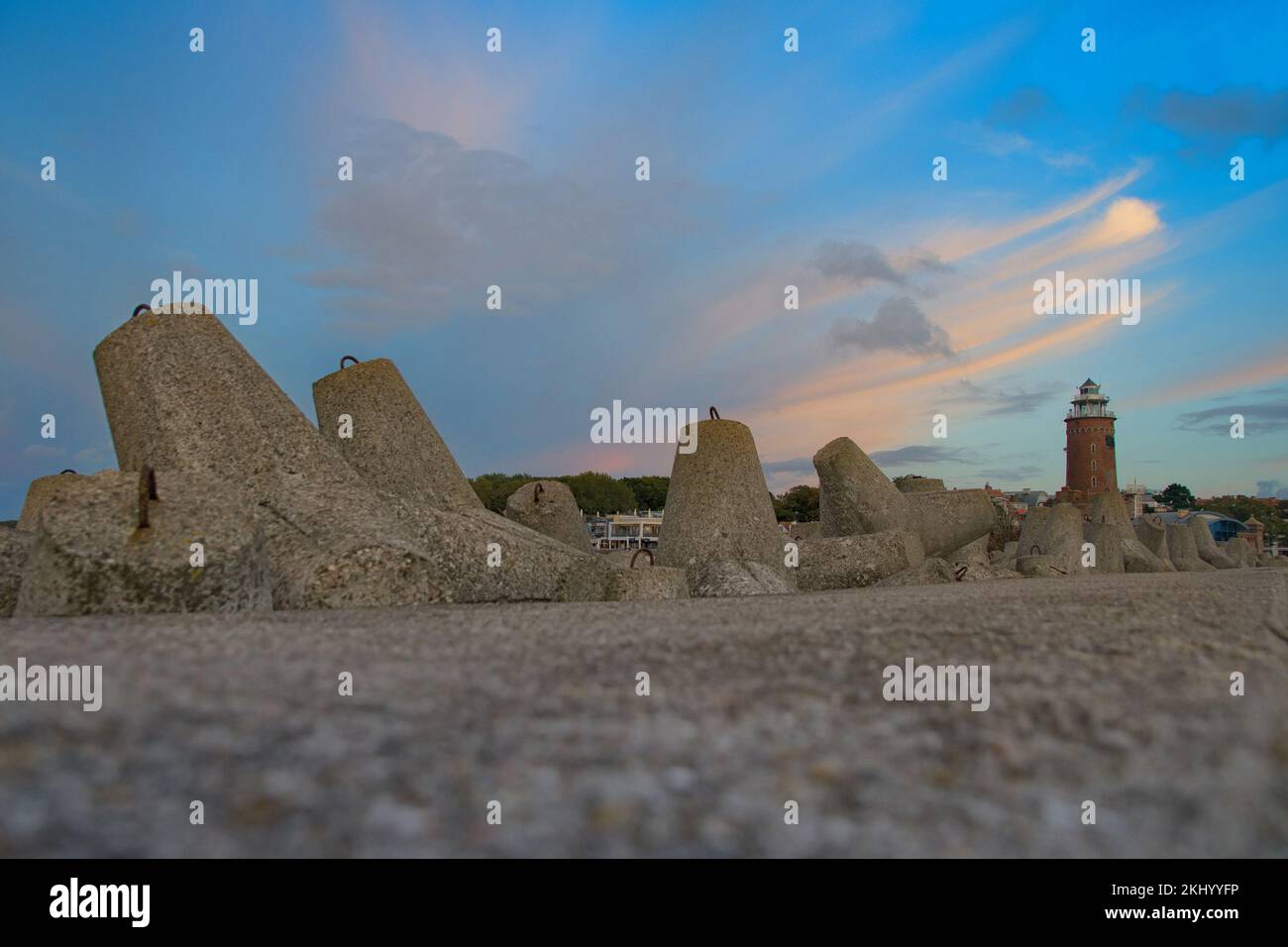 Stacked huge concrete blocks are elements of the breakwater protects ...