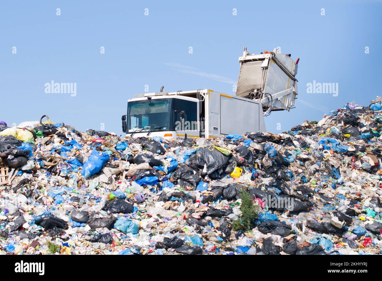Landfill waste disposal. Garbage truck unloads rubbish in landfill ...