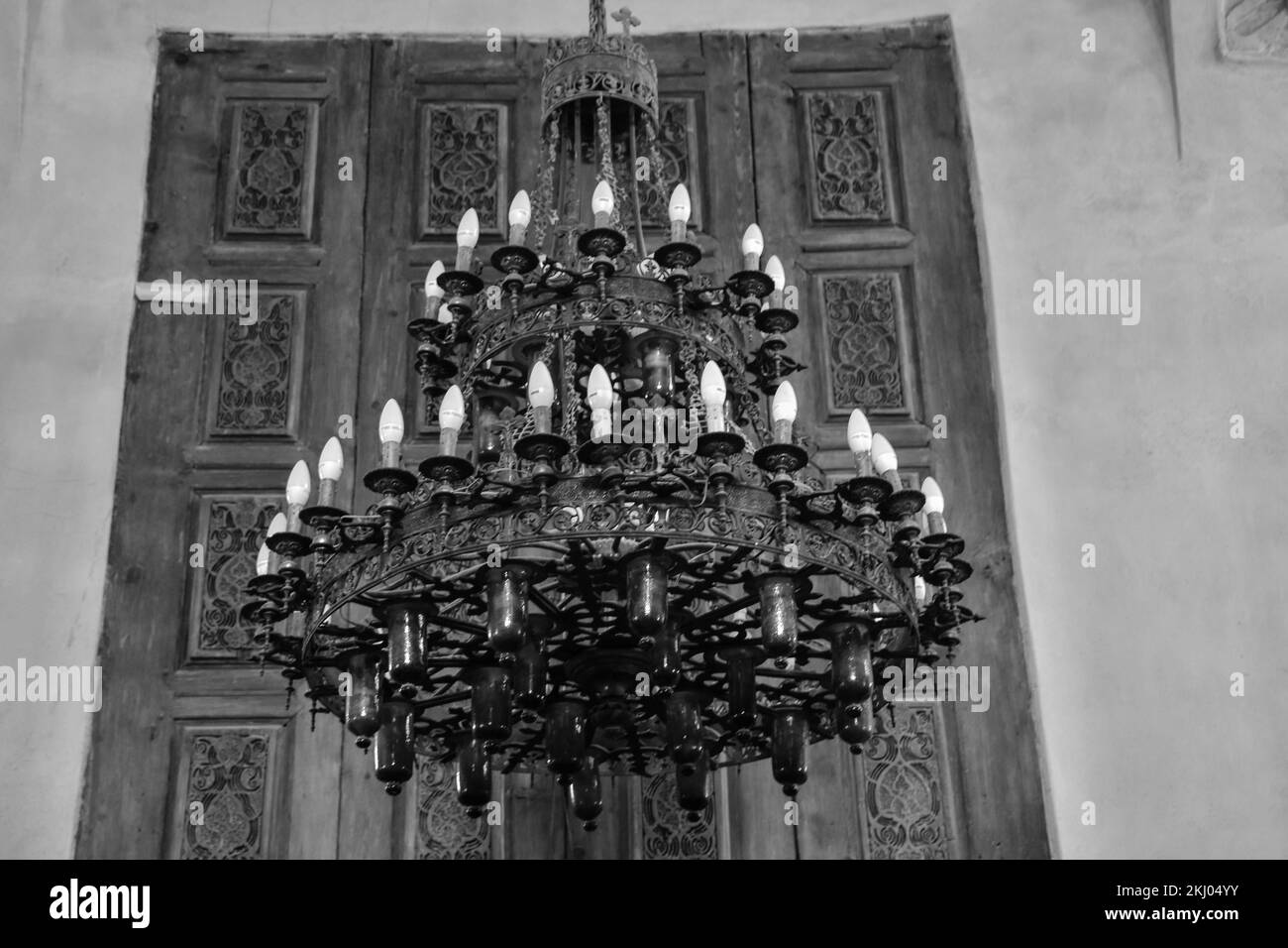 A grayscale shot of an antique chandelier from an old Egyptian ...