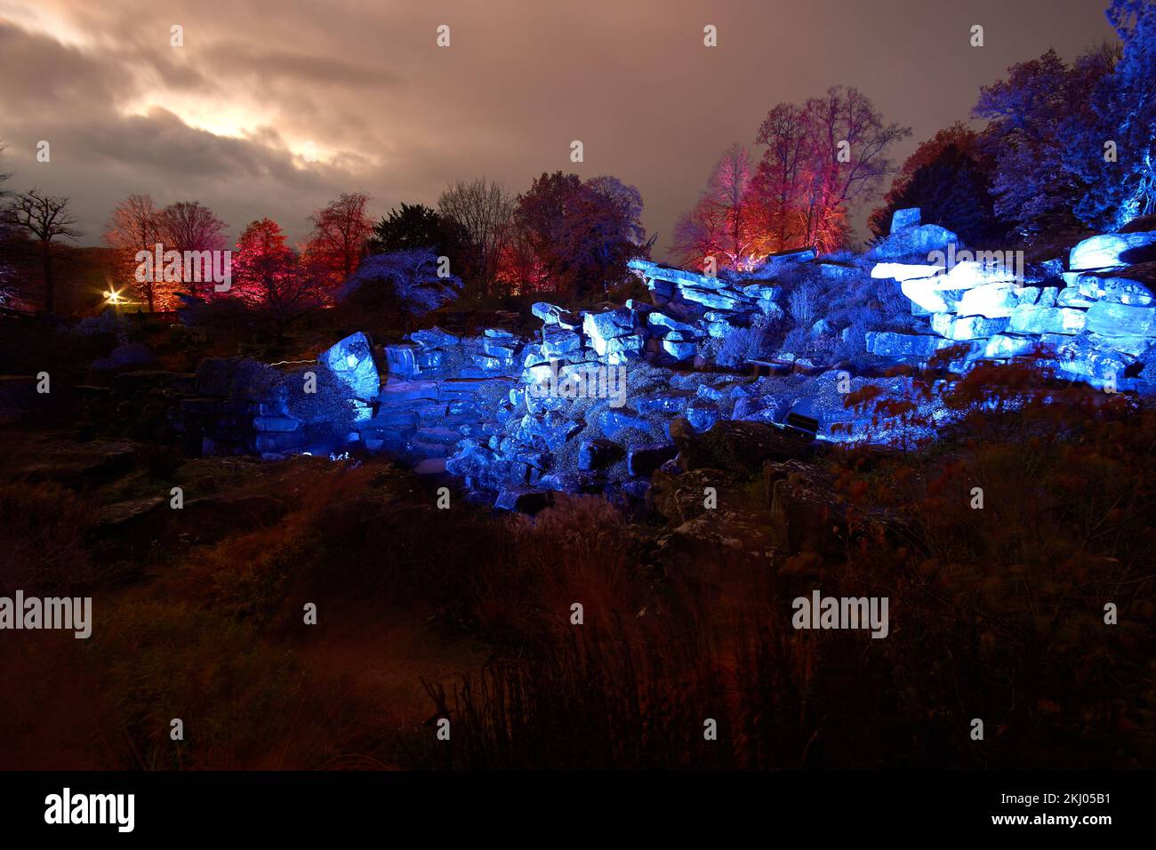 Illuminated rock garden at night Stock Photo - Alamy