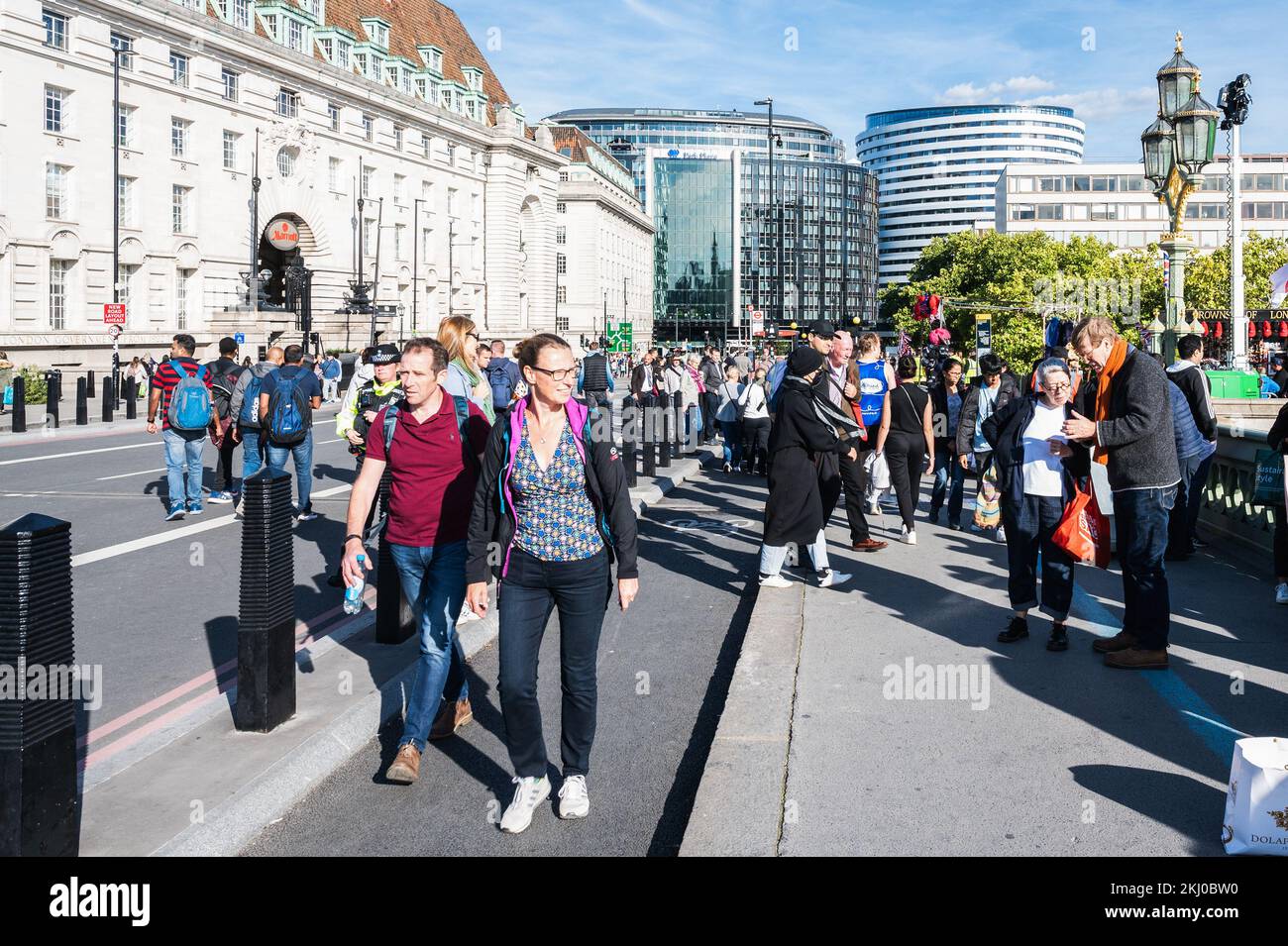 London, United Kingdom - September 17 2022: Crowd of people on streets of London. Queue along ...