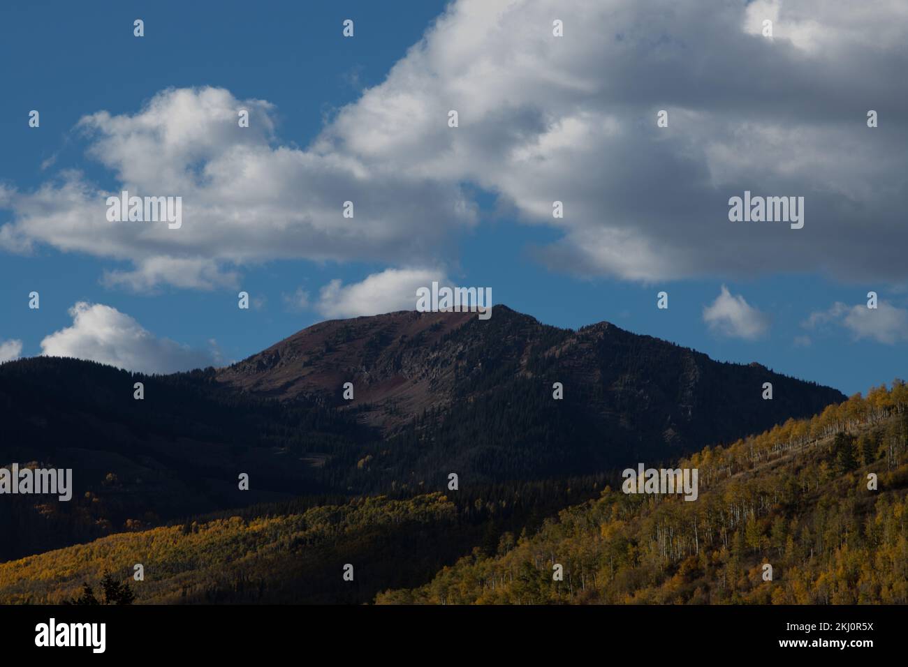 A beautiful view of a mountain with a cloudy sky background in Vail ...
