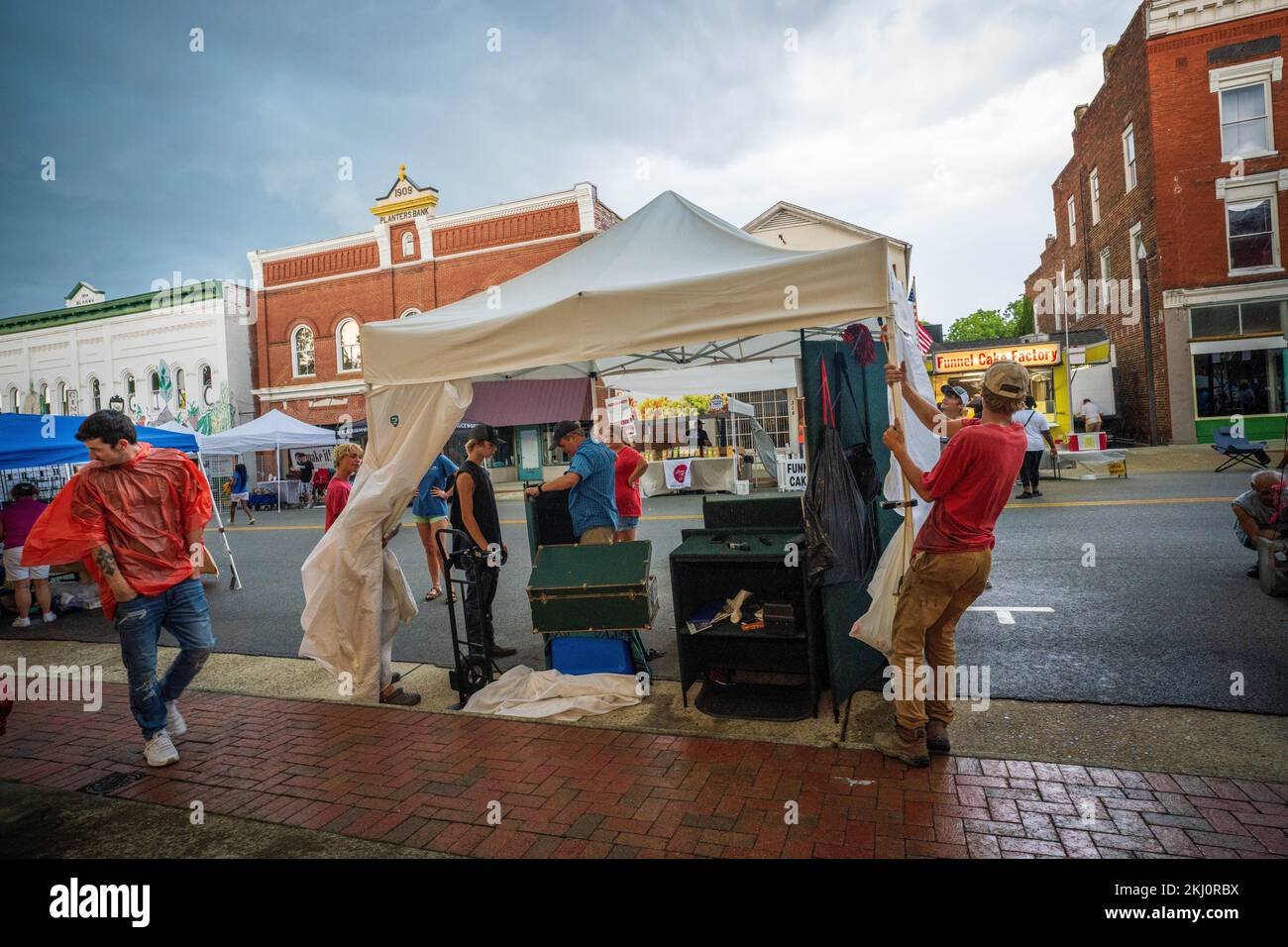 Market stall blown over by thunderstorm at annual fair in Clarksville ...