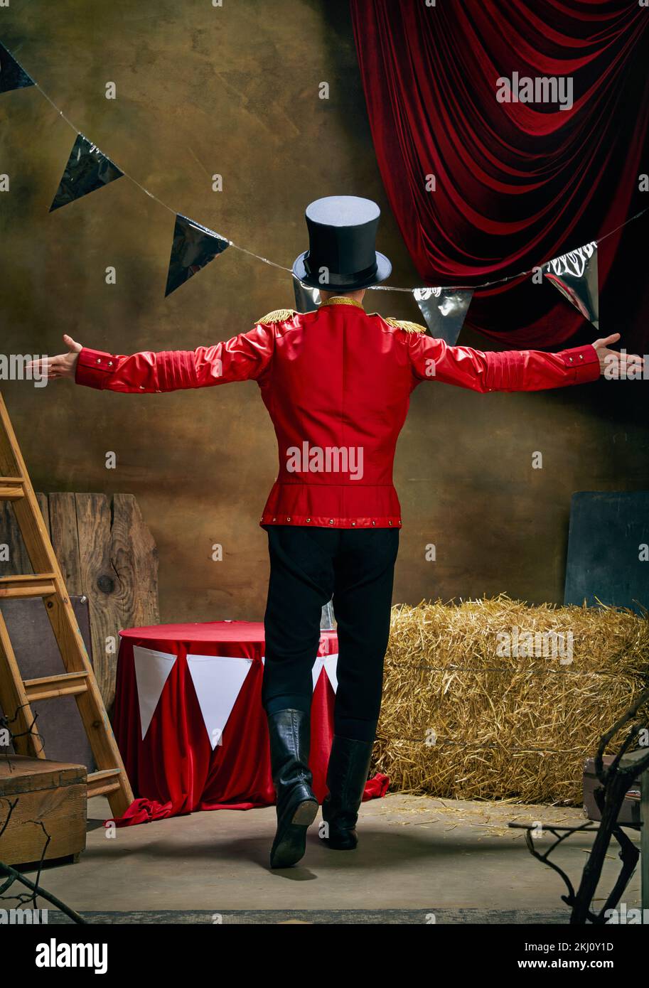 Back view. Illusionist or showman. Young man retro circus entertainer ...