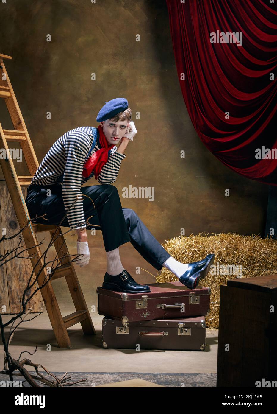 Portrait of male mime artist expressing sadness and loneliness over ...