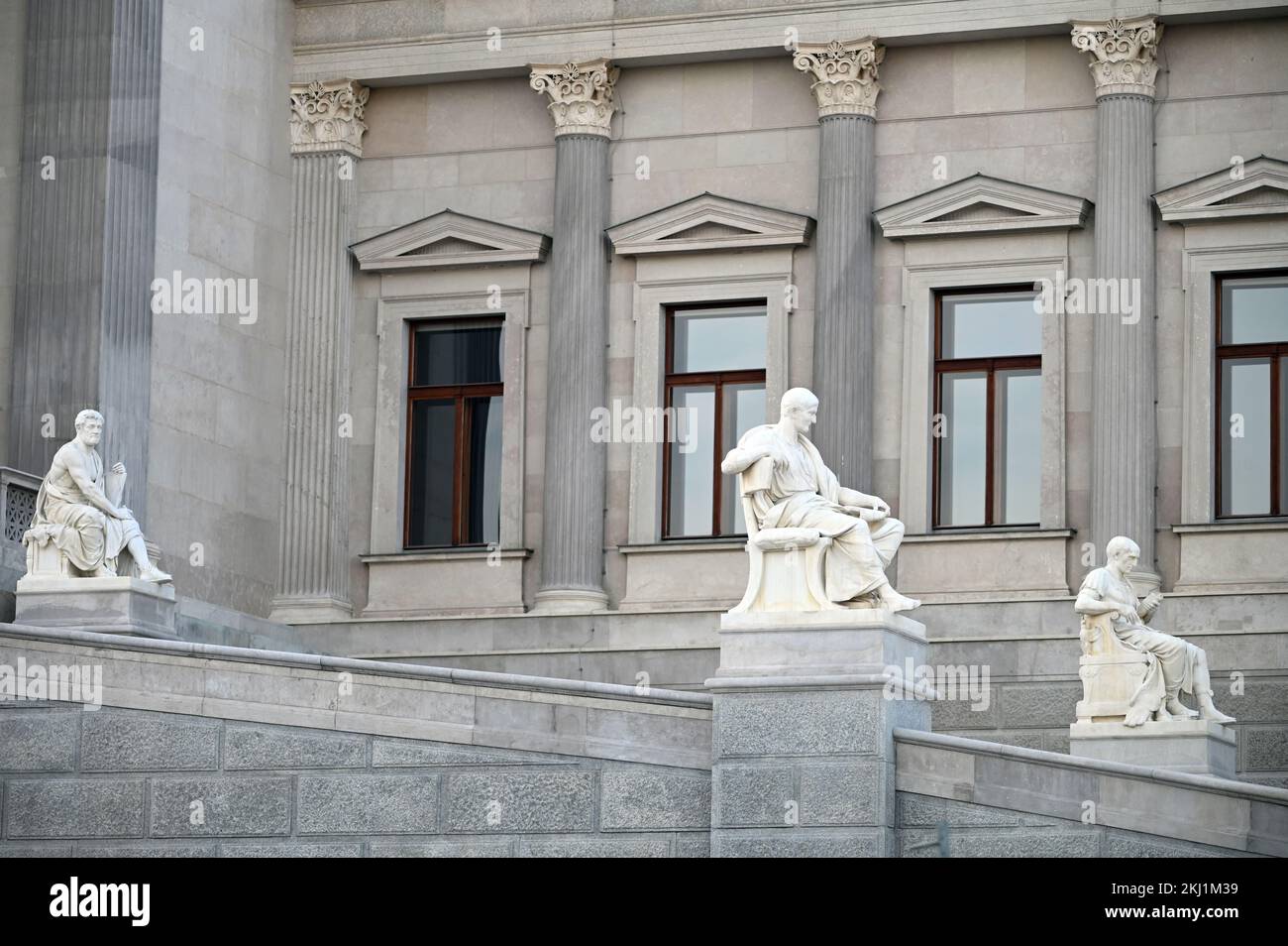 Three statues in front of the Austrian parliament in Vienna Stock Photo ...