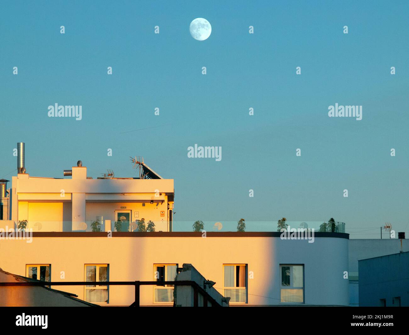 A full moon rises above Cadiz Stock Photo - Alamy