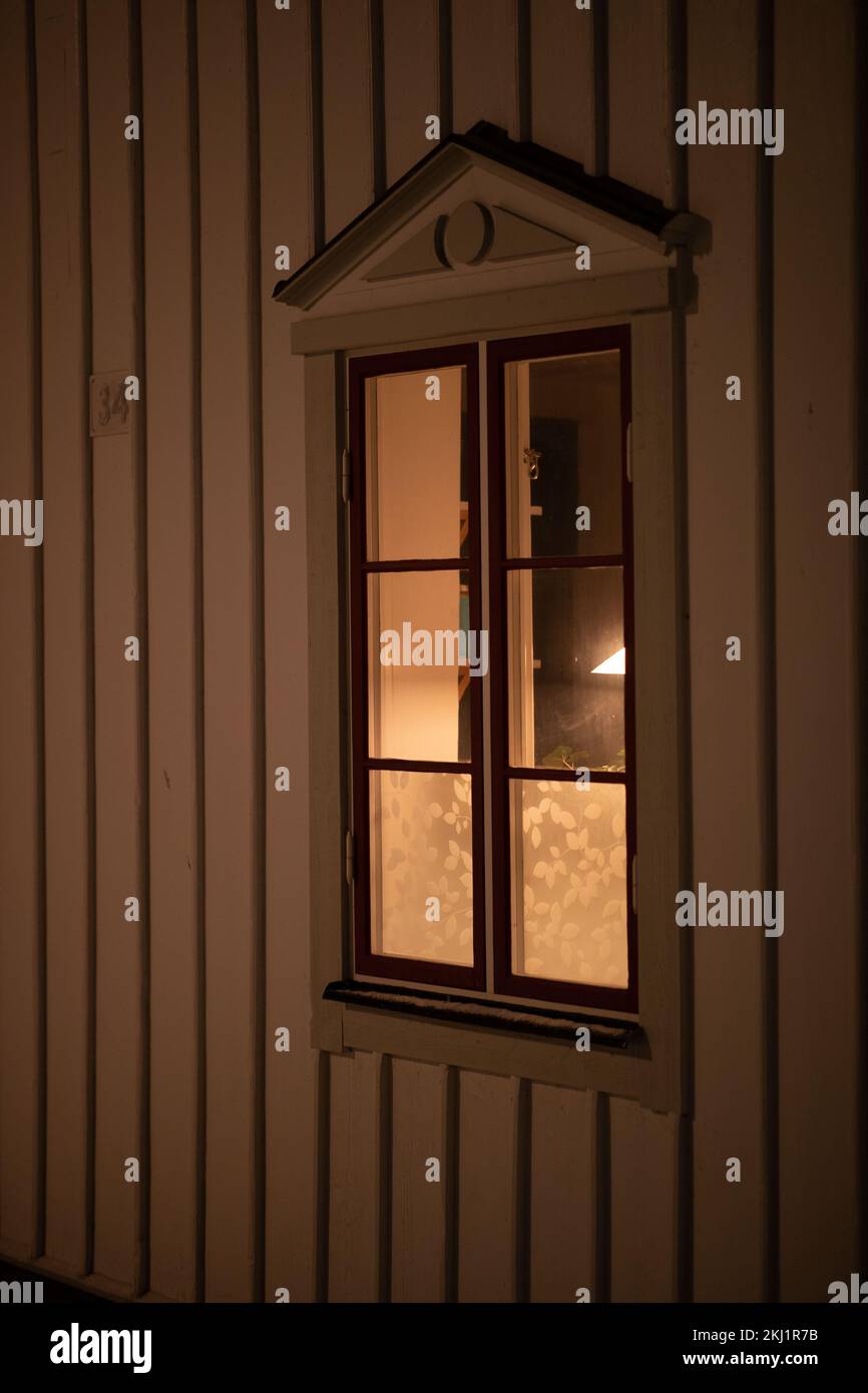 warm light window seen from the street Stock Photo - Alamy