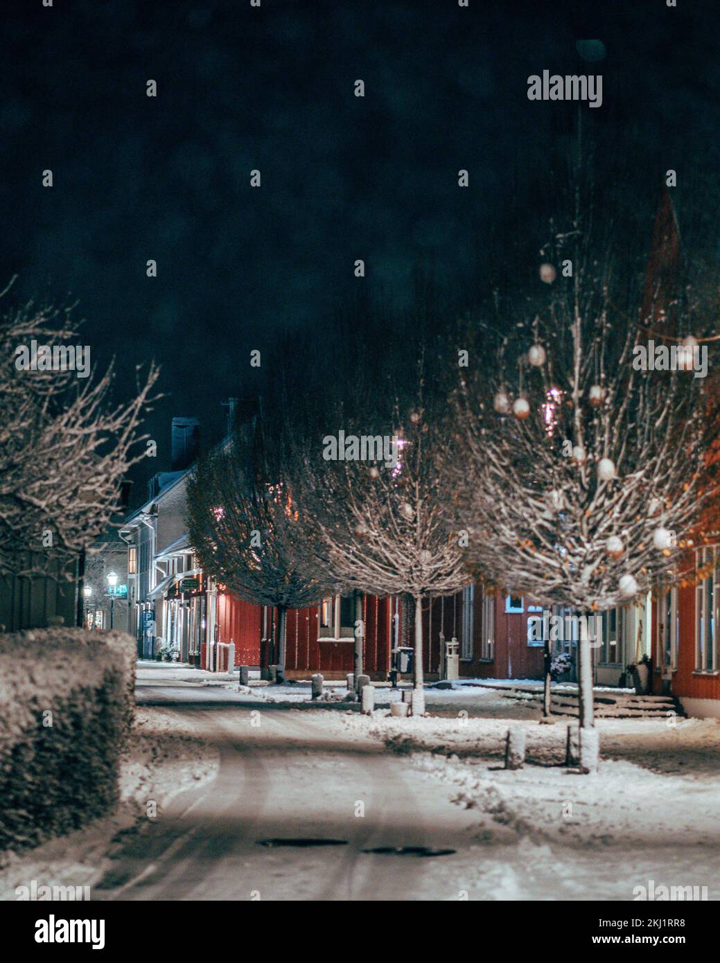 Snowy street in a small town at Christmas time Stock Photo - Alamy