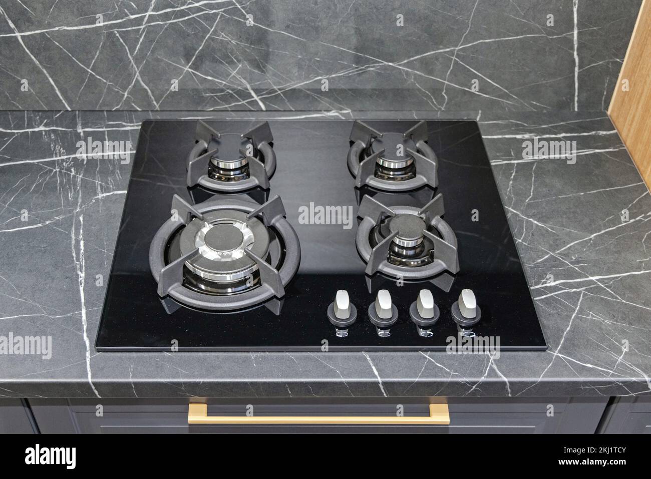 Gas Only Black Cooktop Stove at Marble Kitchen Counter Stock Photo - Alamy