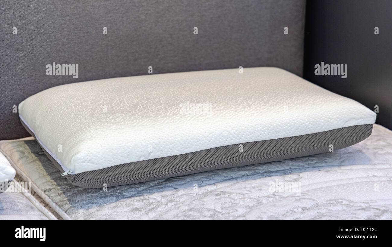 New Clean White Memory Foam Anatomical Pillow at Bed Stock Photo - Alamy