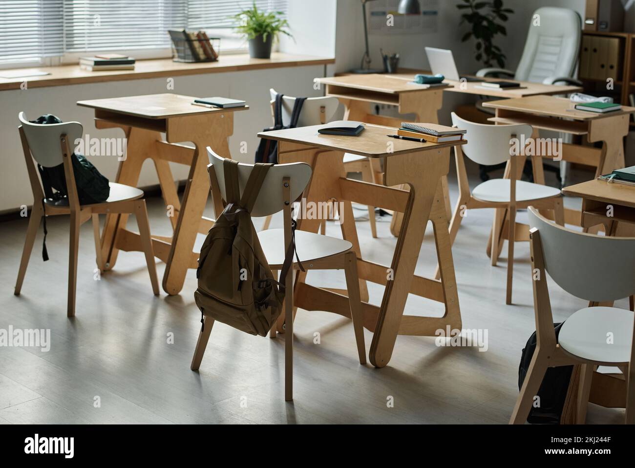 Modern empty classroom with wooden desks for students Stock Photo - Alamy