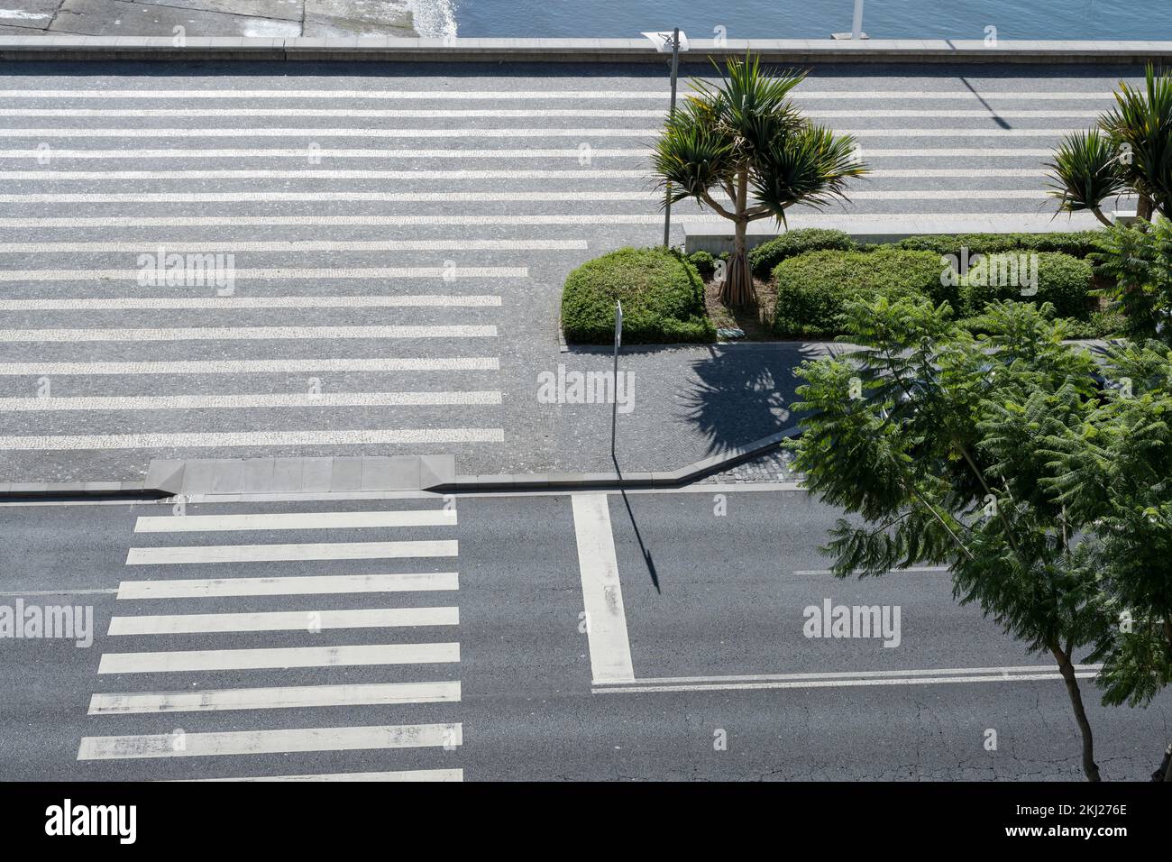 pedestrian crossing and decorated pavement at seafront of historical ...