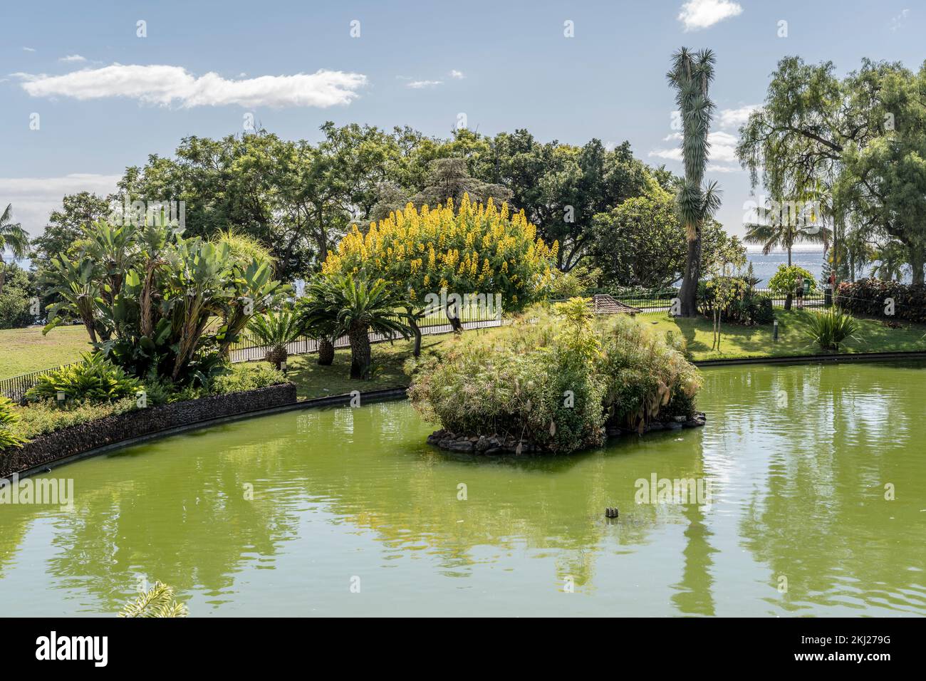 cityscape with lake in public garden of historical town, shot in bright ...