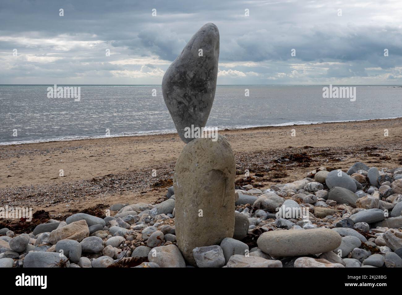 rock balancing on the coast by the sea, a concept of balance and ...
