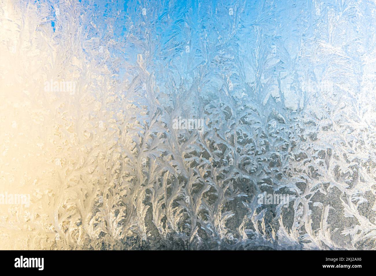 Frozen winter window with shiny ice frost pattern texture. Christmas ...