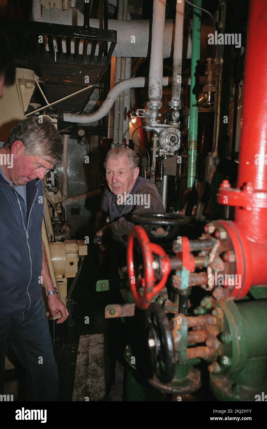 The engine room, with two of the volunteer engineers working on the ...