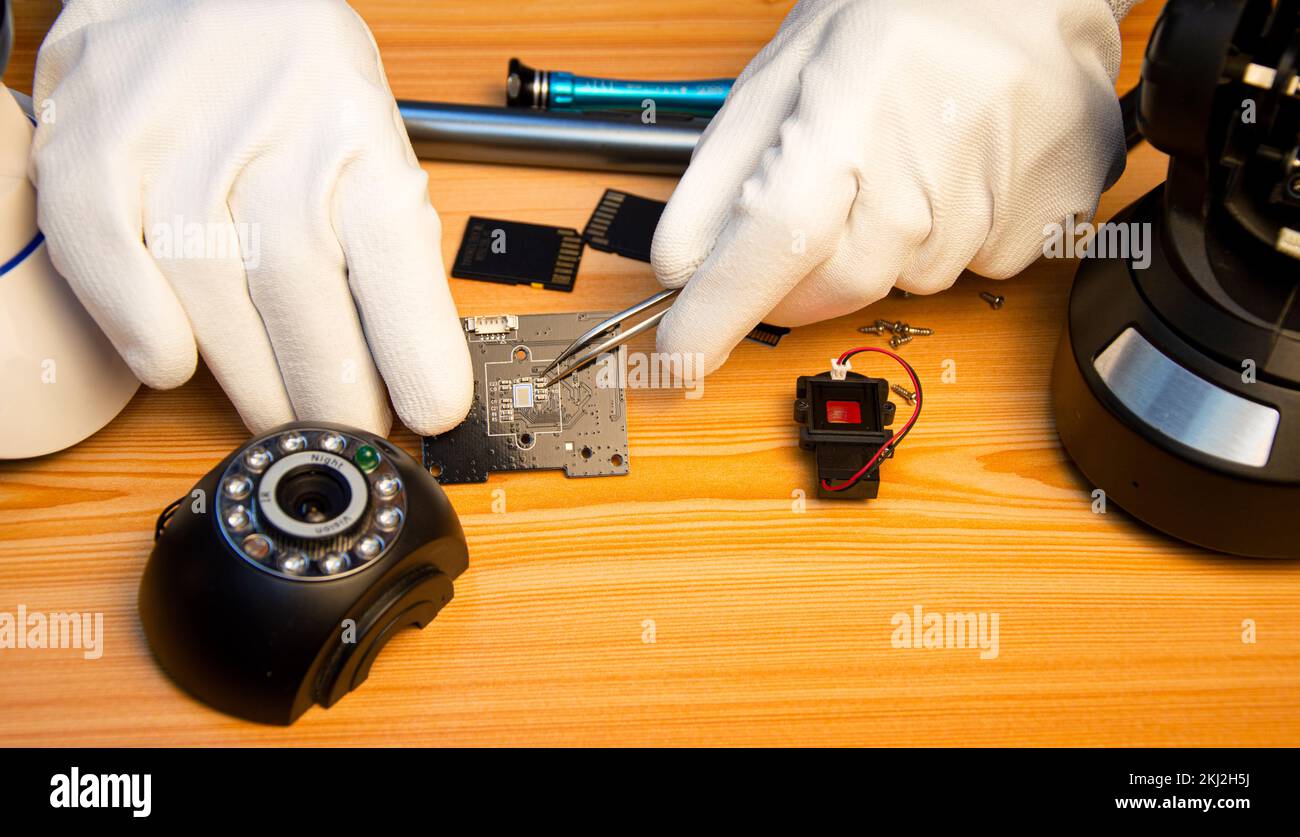 Remove the ip camera to repair cctv Stock Photo - Alamy