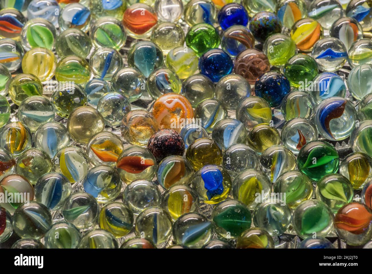 A colourful mixture of vintage marbles including some cat's eyes (cats ...