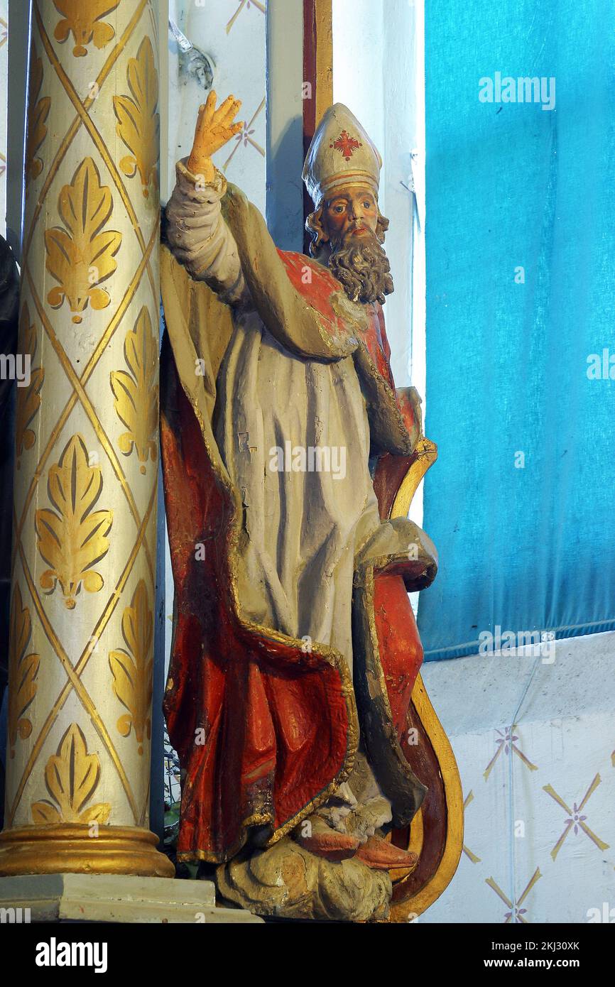 Statue of the Saint on the main altar in the parish church of the Holy ...