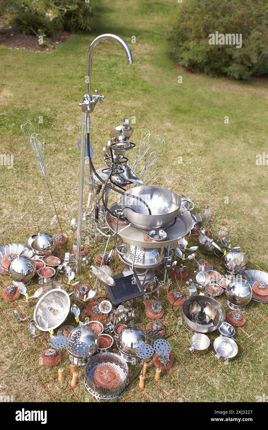 Set of new kitchen dishes on the grass Stock Photo - Alamy