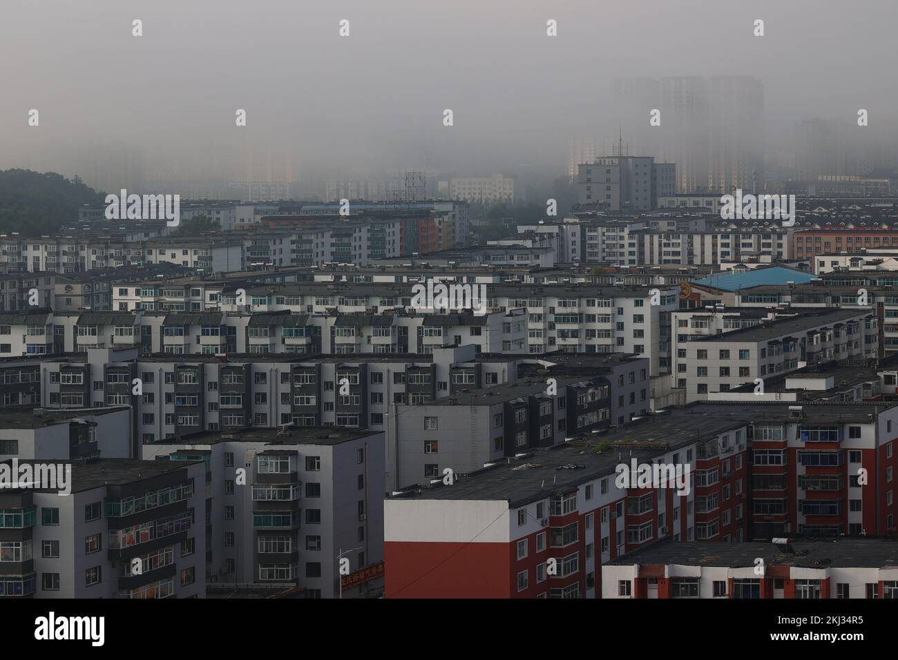 An aerial cloudy view of the Baicheng city buildings in China Stock Photo - Alamy