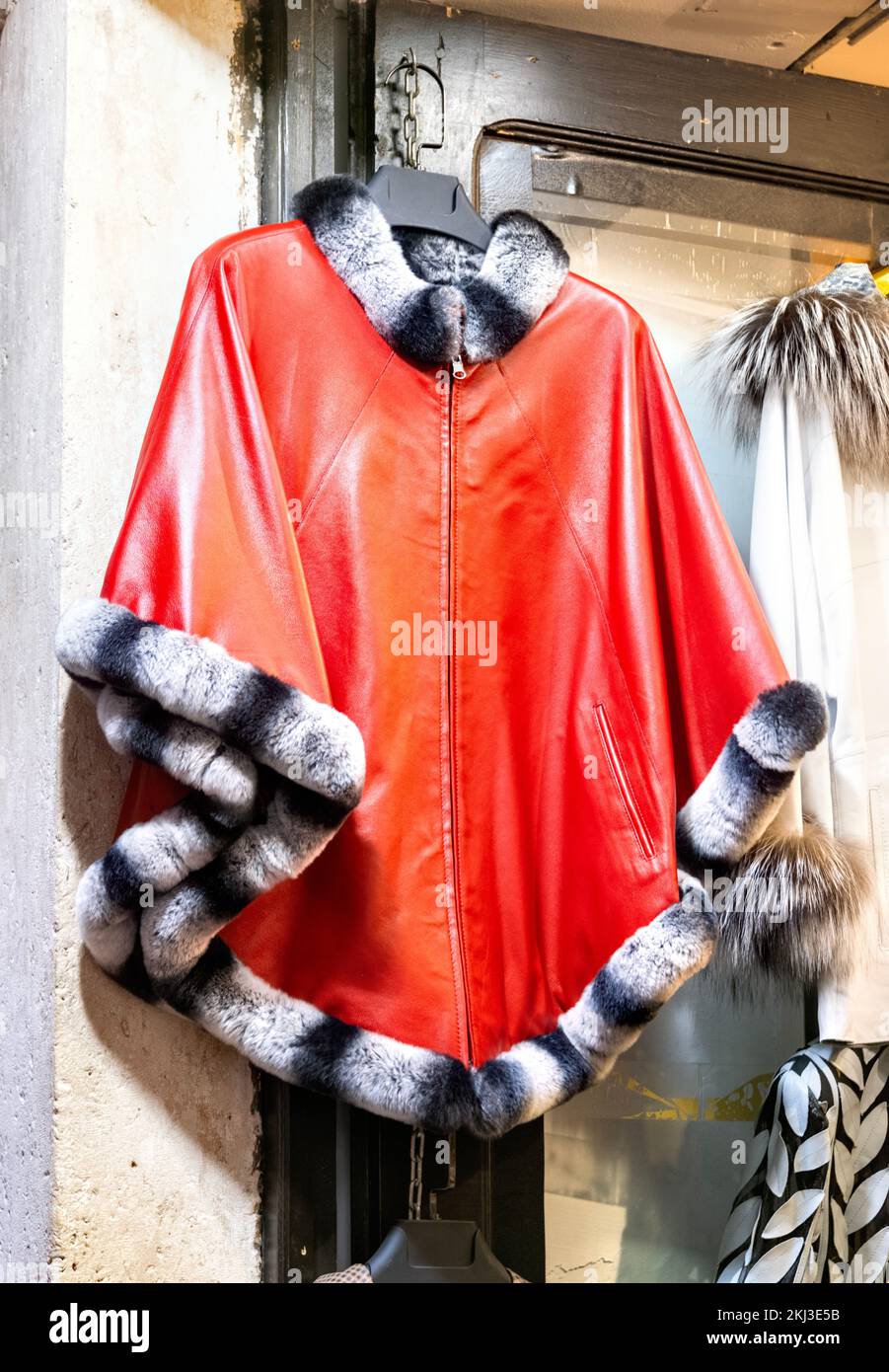Red Ladies leather cape with fur trim on sale outside a shop in Kotor ...