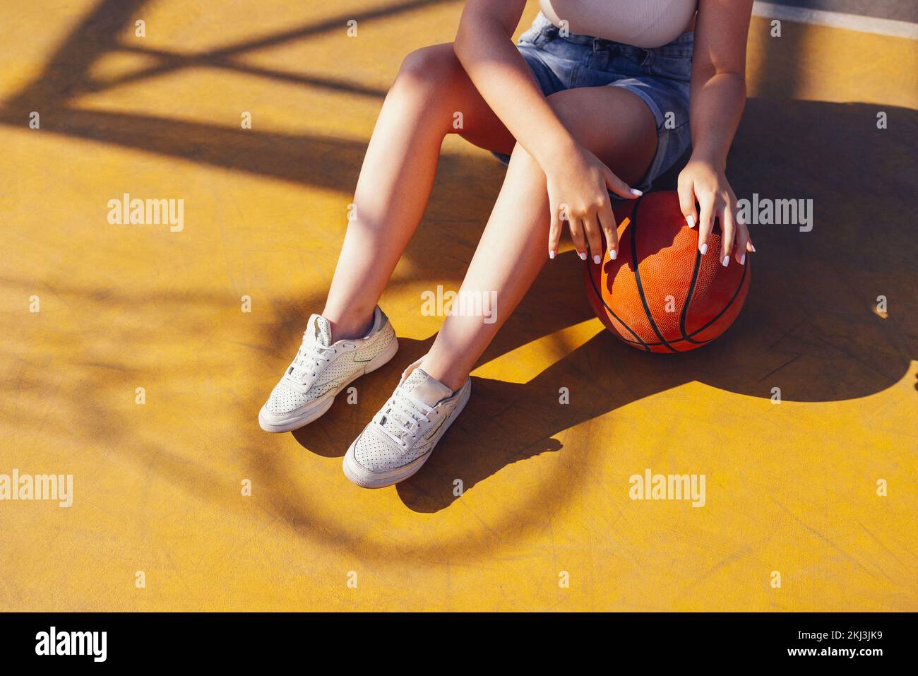 Teen girls playing basketball outdoors hi-res stock photography and ...