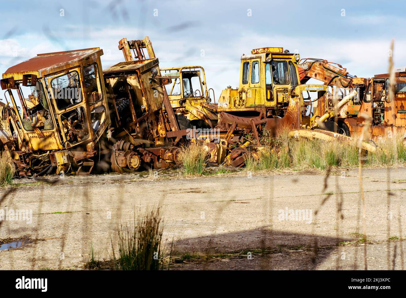 Run down old farm equipment Stock Photo - Alamy