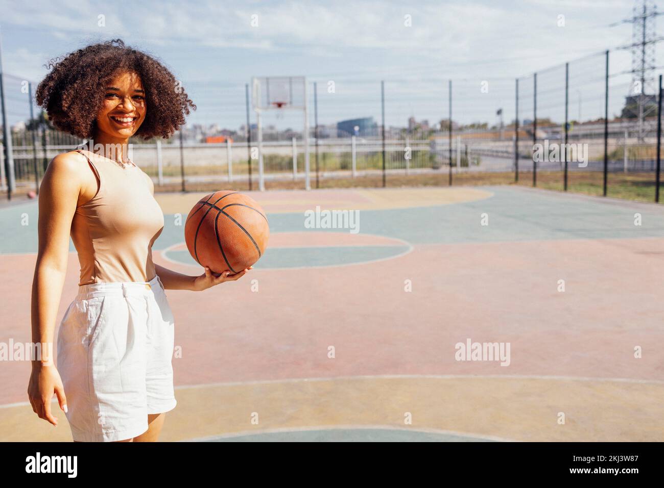 Mixed race young smiling female outdoors and having fun. Stylish cool ...