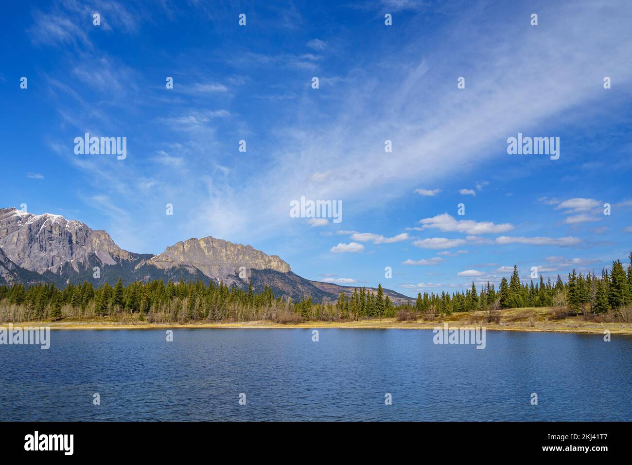 Looking out over Middle Lake towards Mount Yamnuska in Bow Valley ...