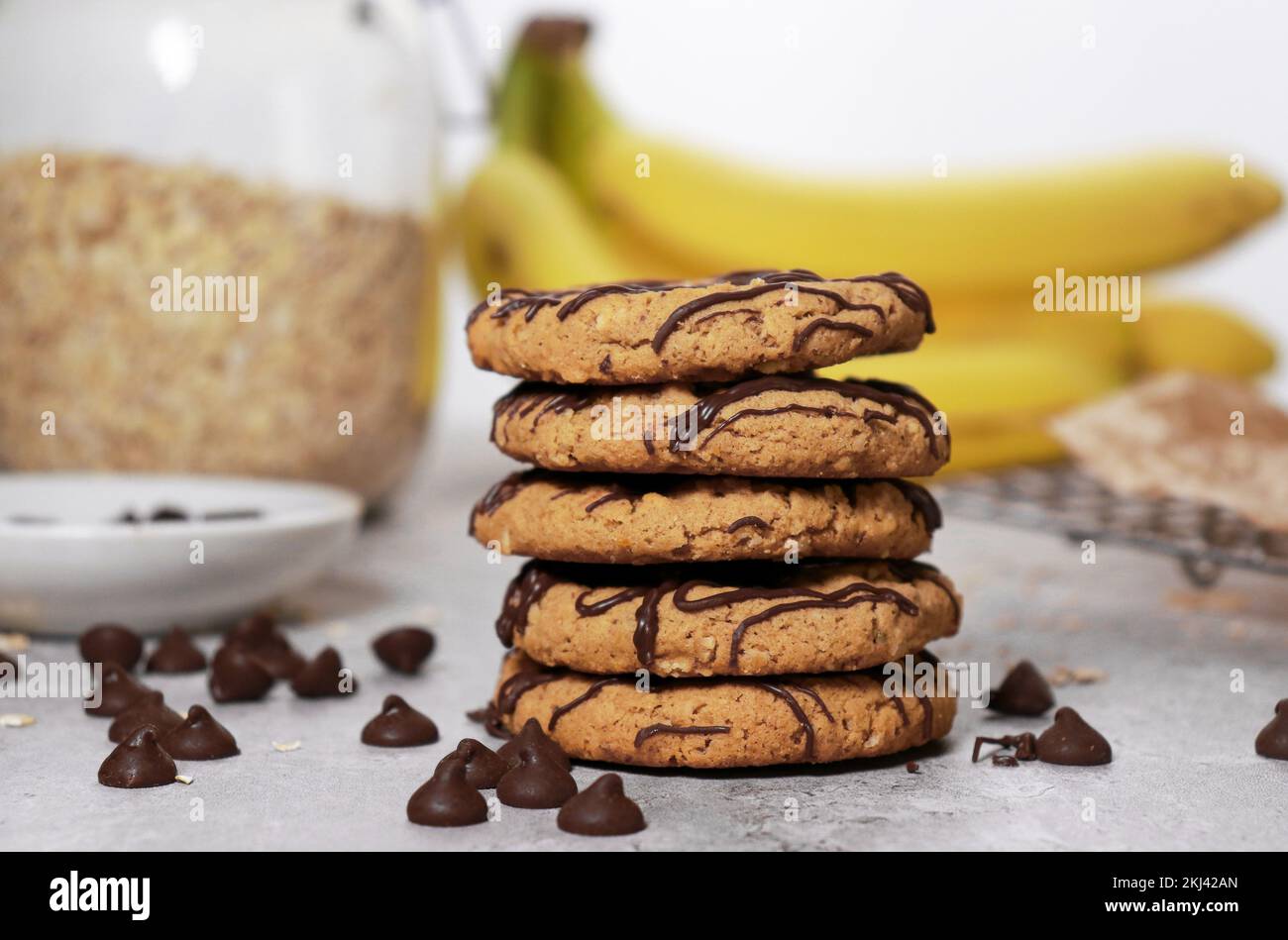 banana oatmeal cookies with chocolate chips, bananas in background ...
