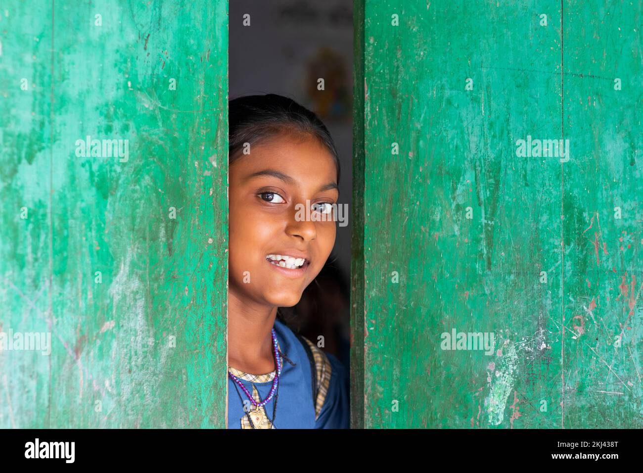 School girl peeping from a classroom Stock Photo - Alamy