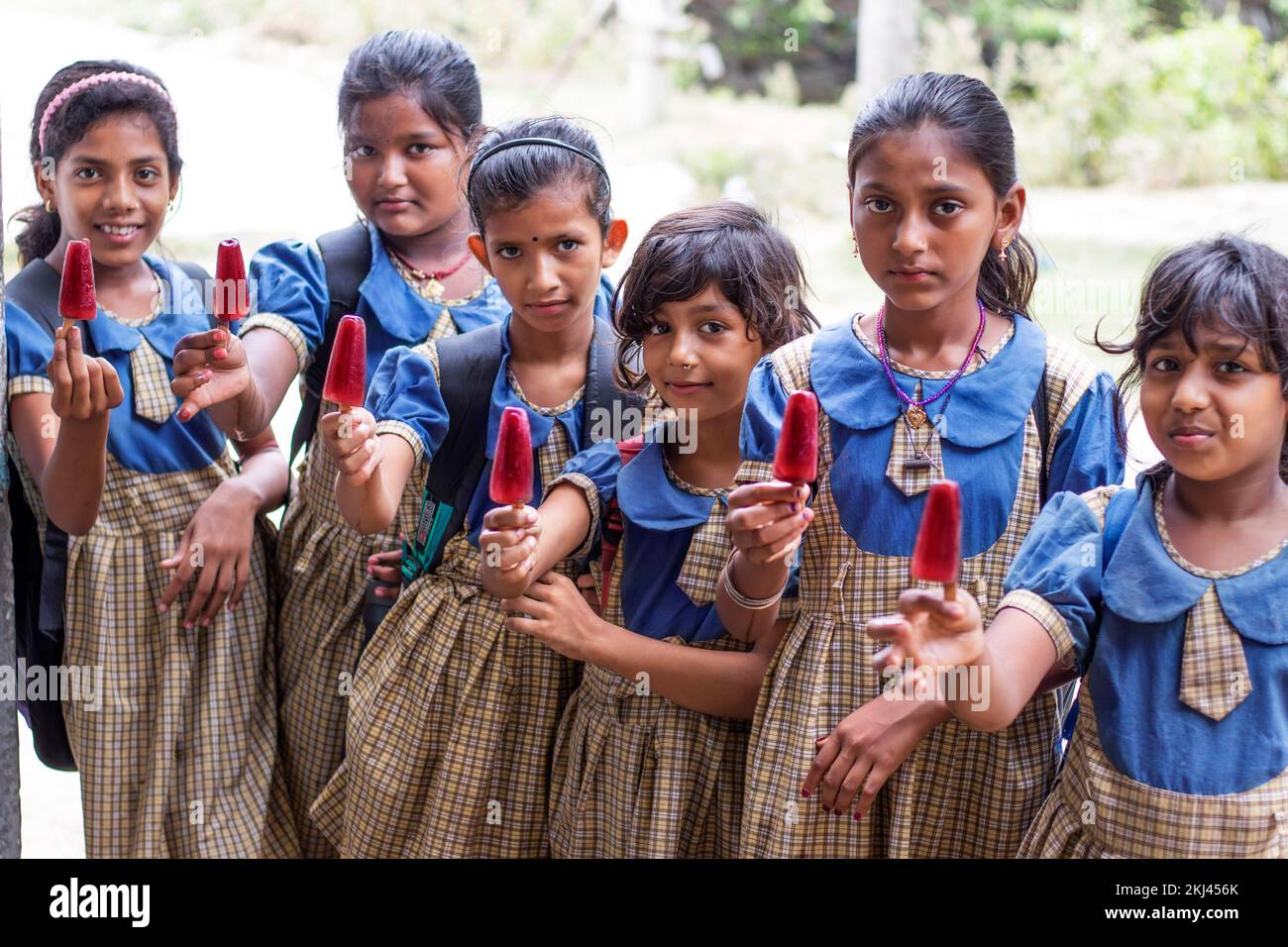 School Children's eating an ice lolly in outdoor Stock Photo - Alamy