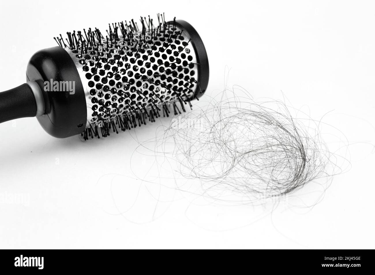 Round comb with fallen hair. Close up. White background. Hair fall ...