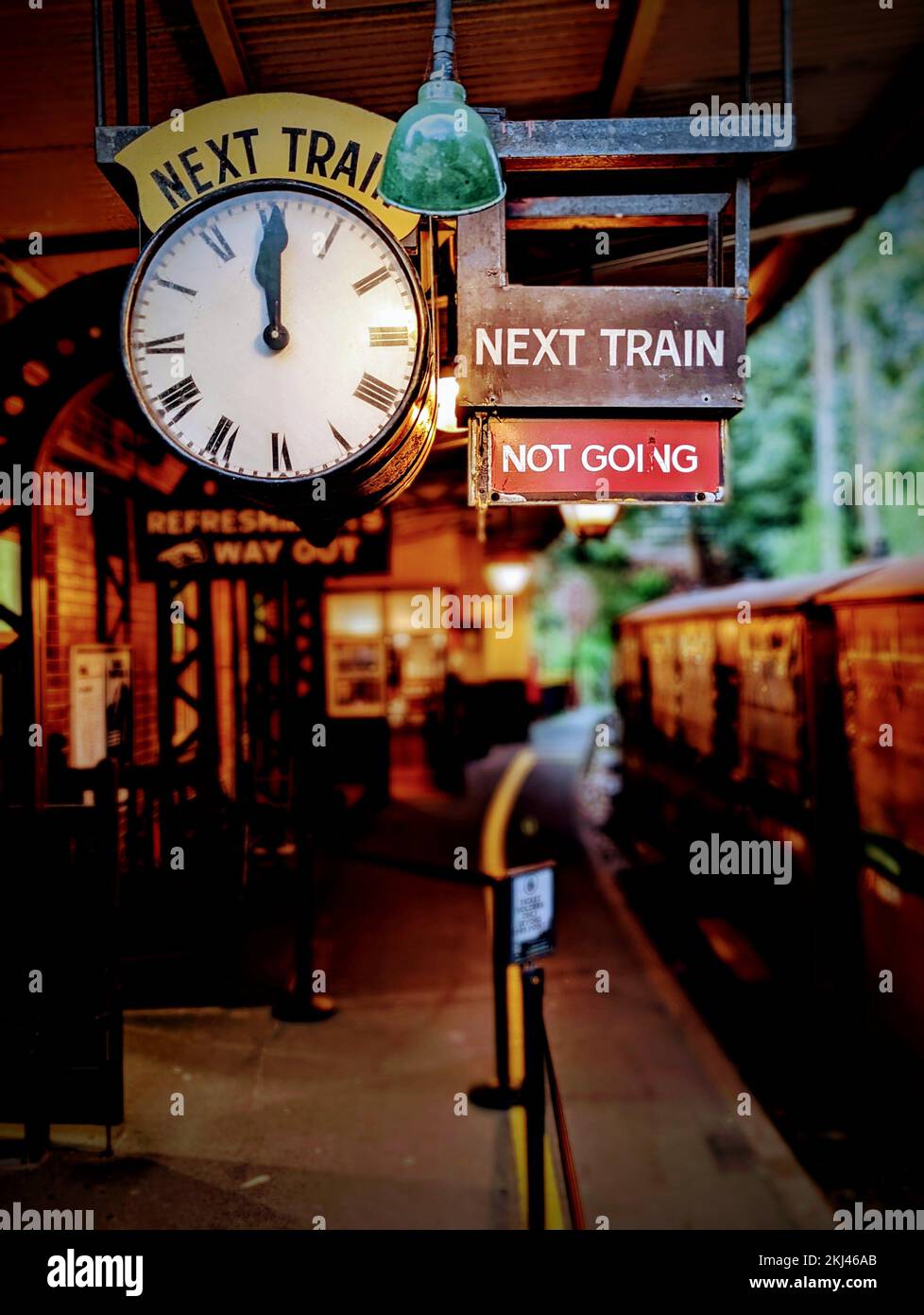 A vertical of a next train clock in a train station Stock Photo - Alamy