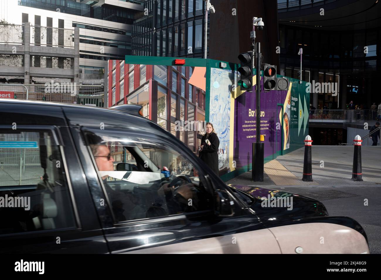 A taxi driver approaches a pedestrian who is crossing Eldon Street ...