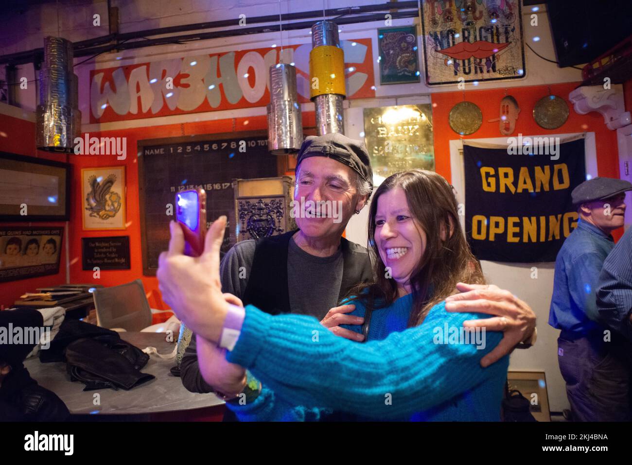 Band member Greg Davis poses for a selfie with a fan after the first ...
