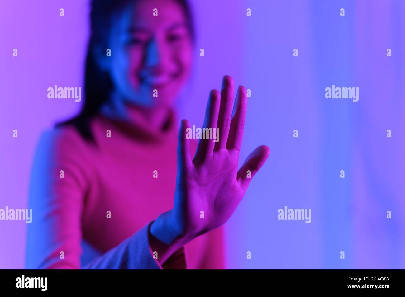 A shallow focus shot of a southeast Asian female hands in the colorful ...