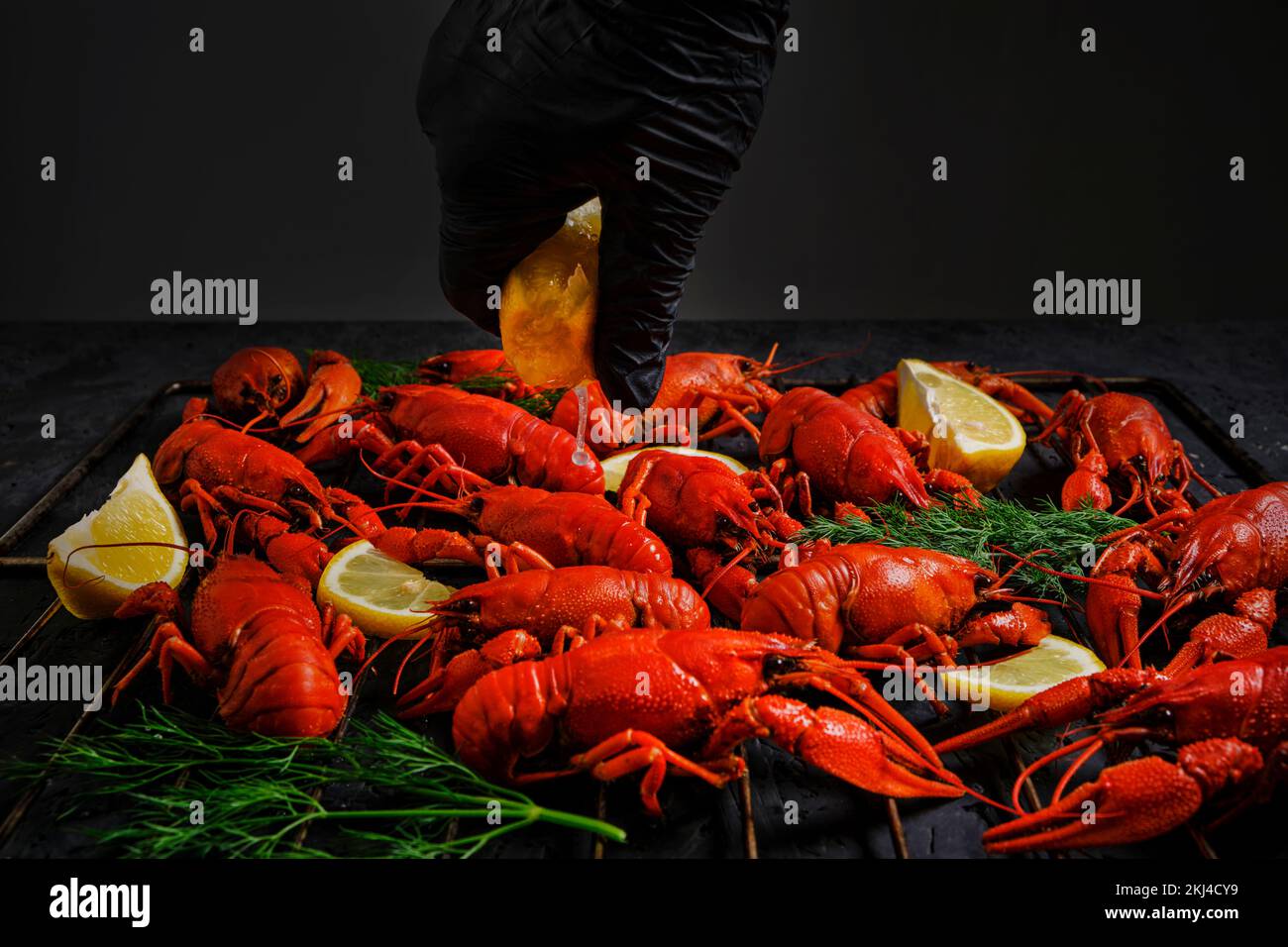 Cook squeezes lemon juice on hi-res stock photography and images - Alamy