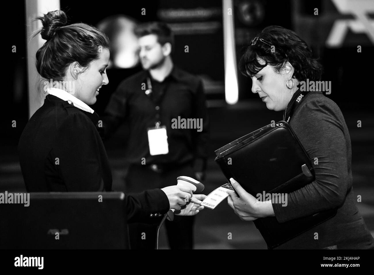 A view of delegate guests signing in at registration at the convention ...
