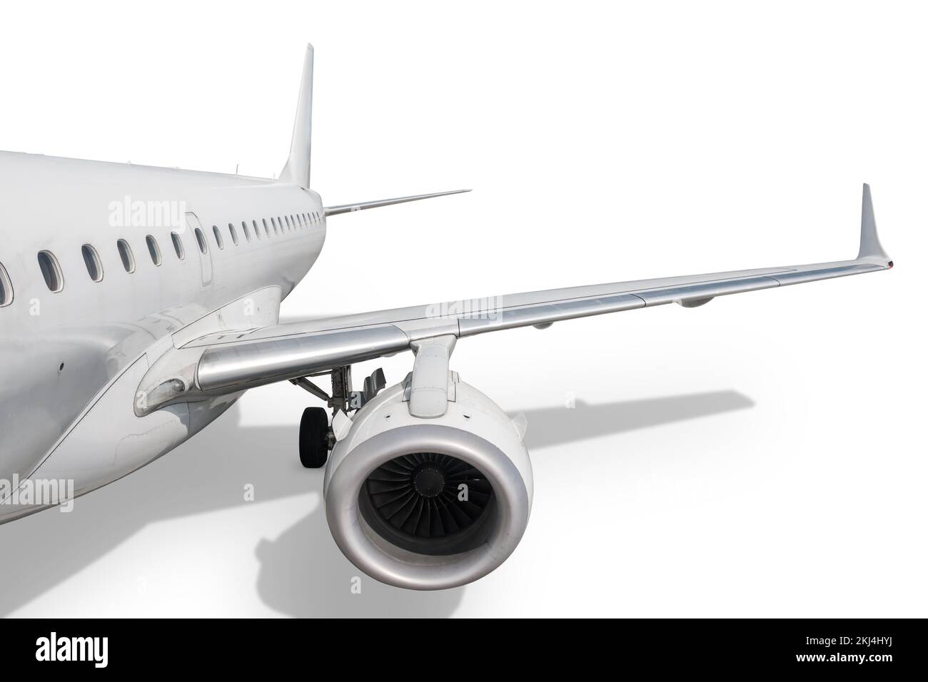 Passenger airliner isolated on white background. View of the wing and ...