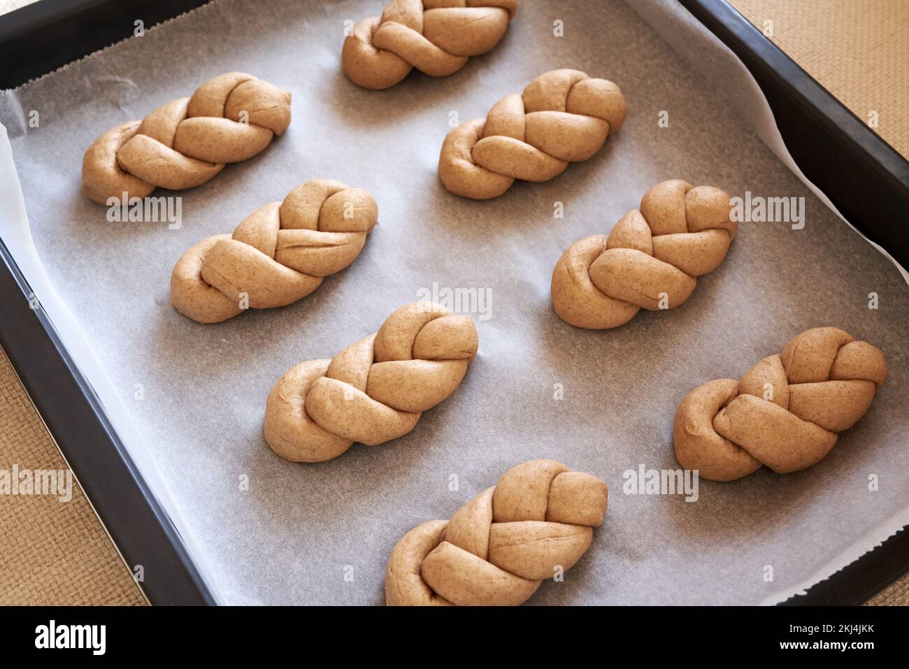 Preparation of plaited bread rolls from whole grain spelt flour - raw ...