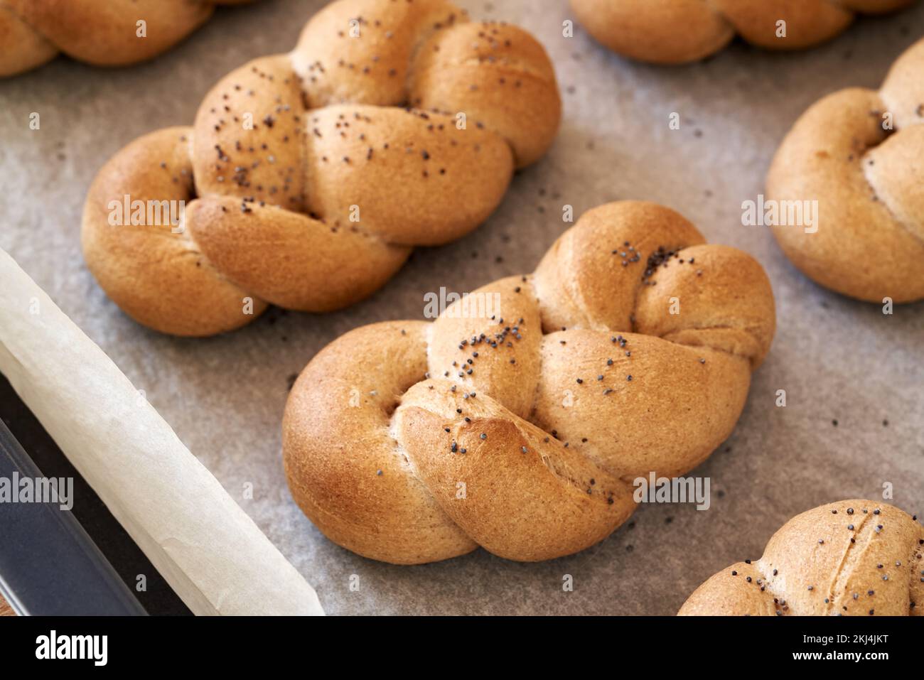Braided bread rolls or buns made from whole grain spelt flour ...