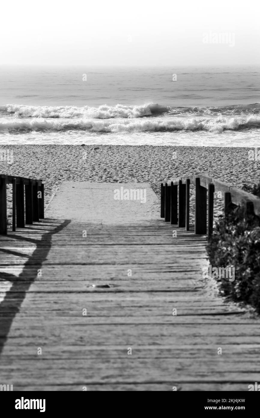 Wooden walkway to Comporta beach in the morning on a sunny day in ...