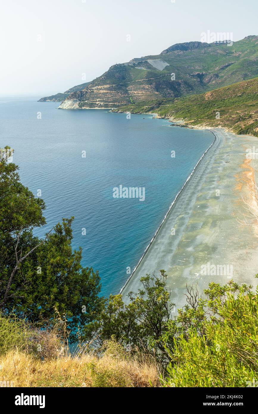 The beautiful black beach near Nonza on a summer afternoon, in Corse ...